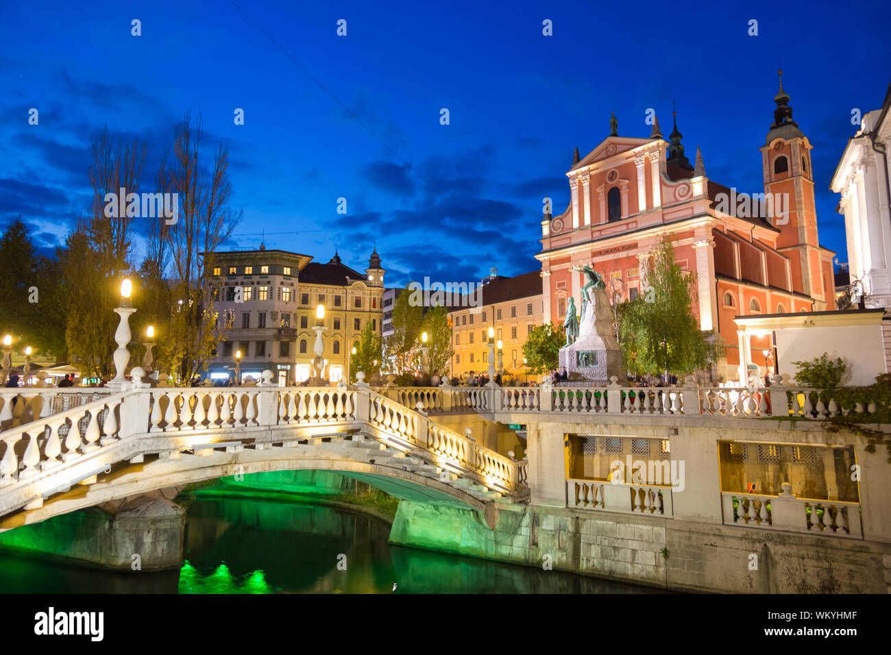 Romantic Ljubljana's city center at dusk. River Ljubljanica, Triple ...