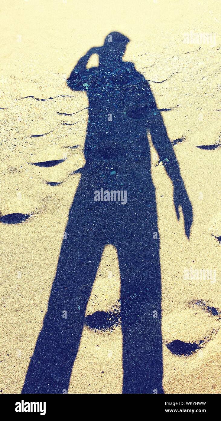 Shadow Of Man On Beach During Sunny Day Stock Photo - Alamy