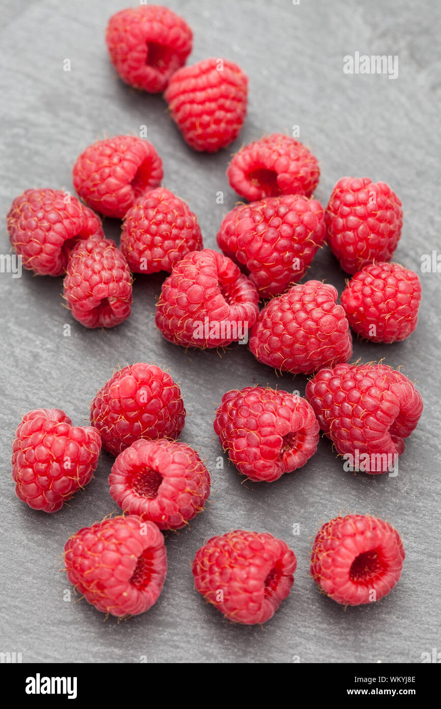 Fresh raspberries on a grey slate Stock Photo - Alamy