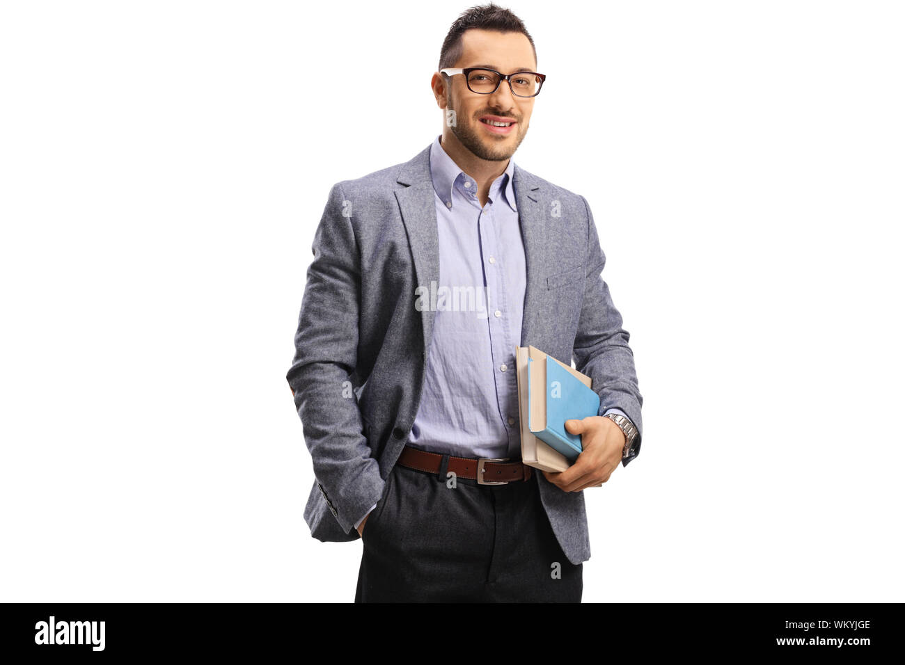 Young man holding books and smiling at the camera isolated on white ...