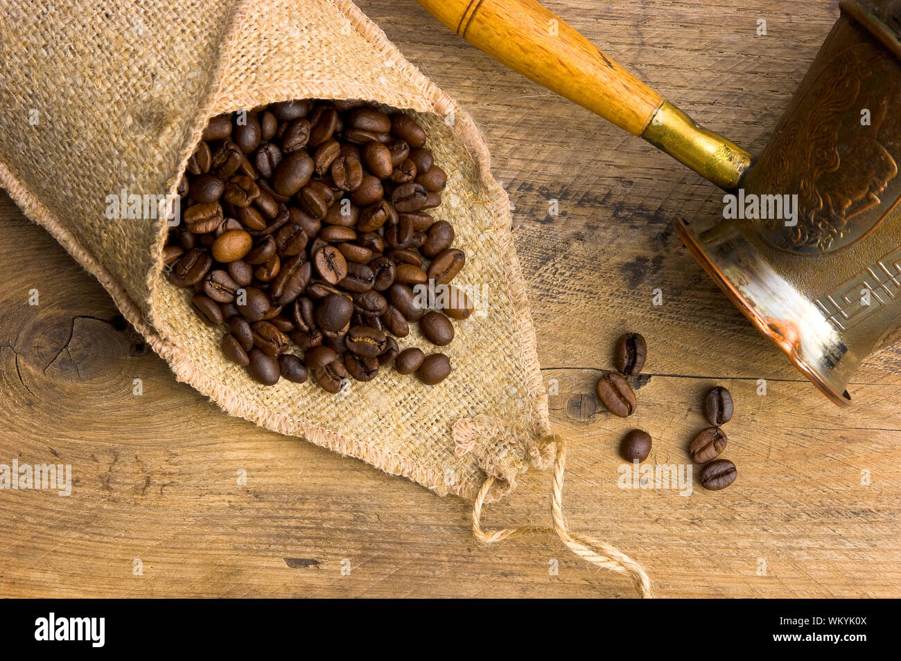 Coffee beans spilled out of the bag Stock Photo - Alamy