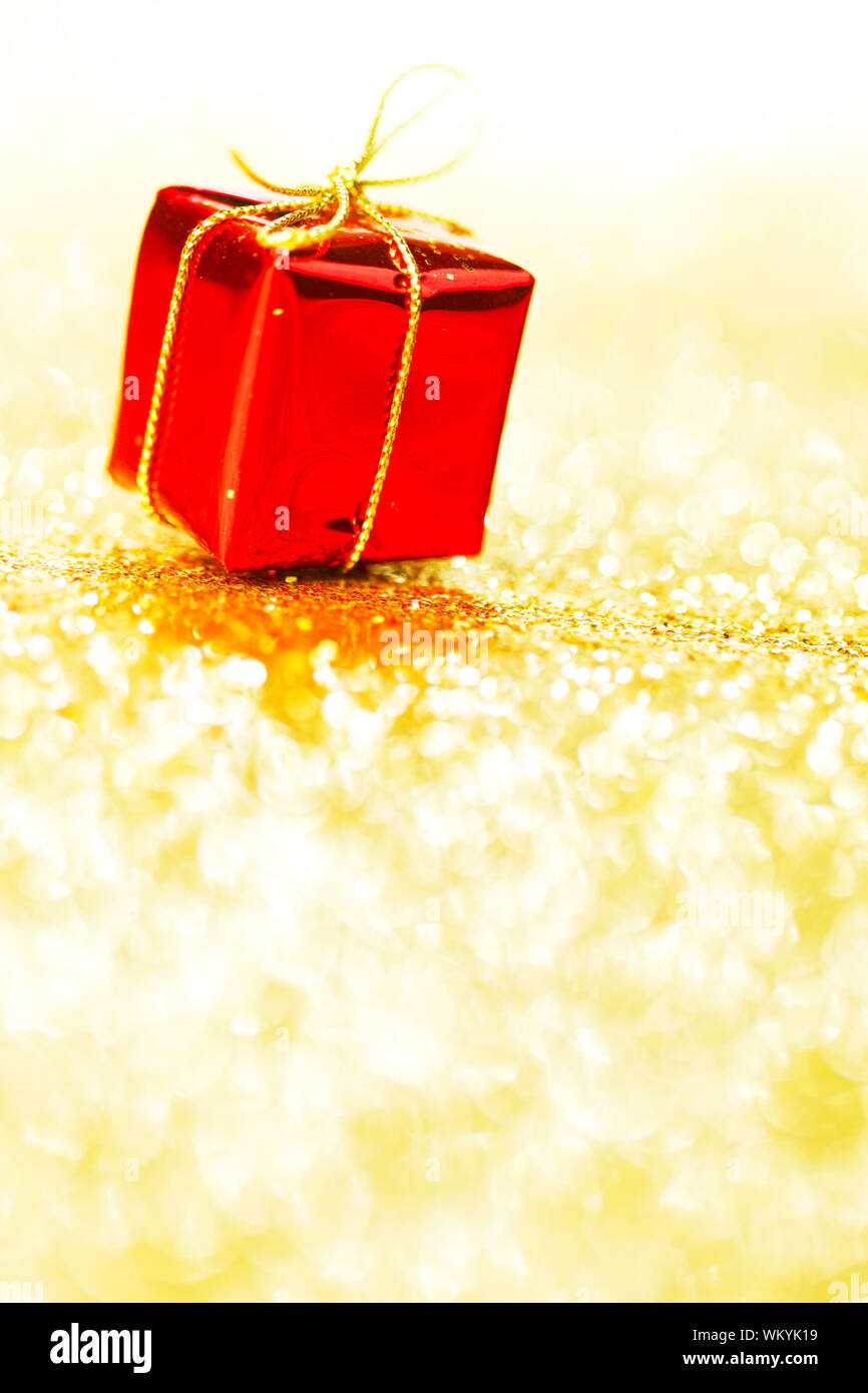 Decorative red box with holiday gift on shiny glitter background Stock ...