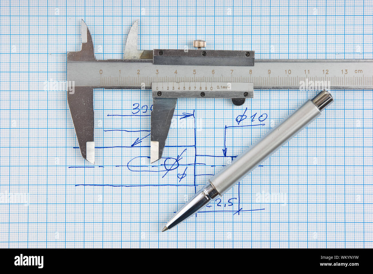 calipers, bearing and square on the background of graph paper Stock ...