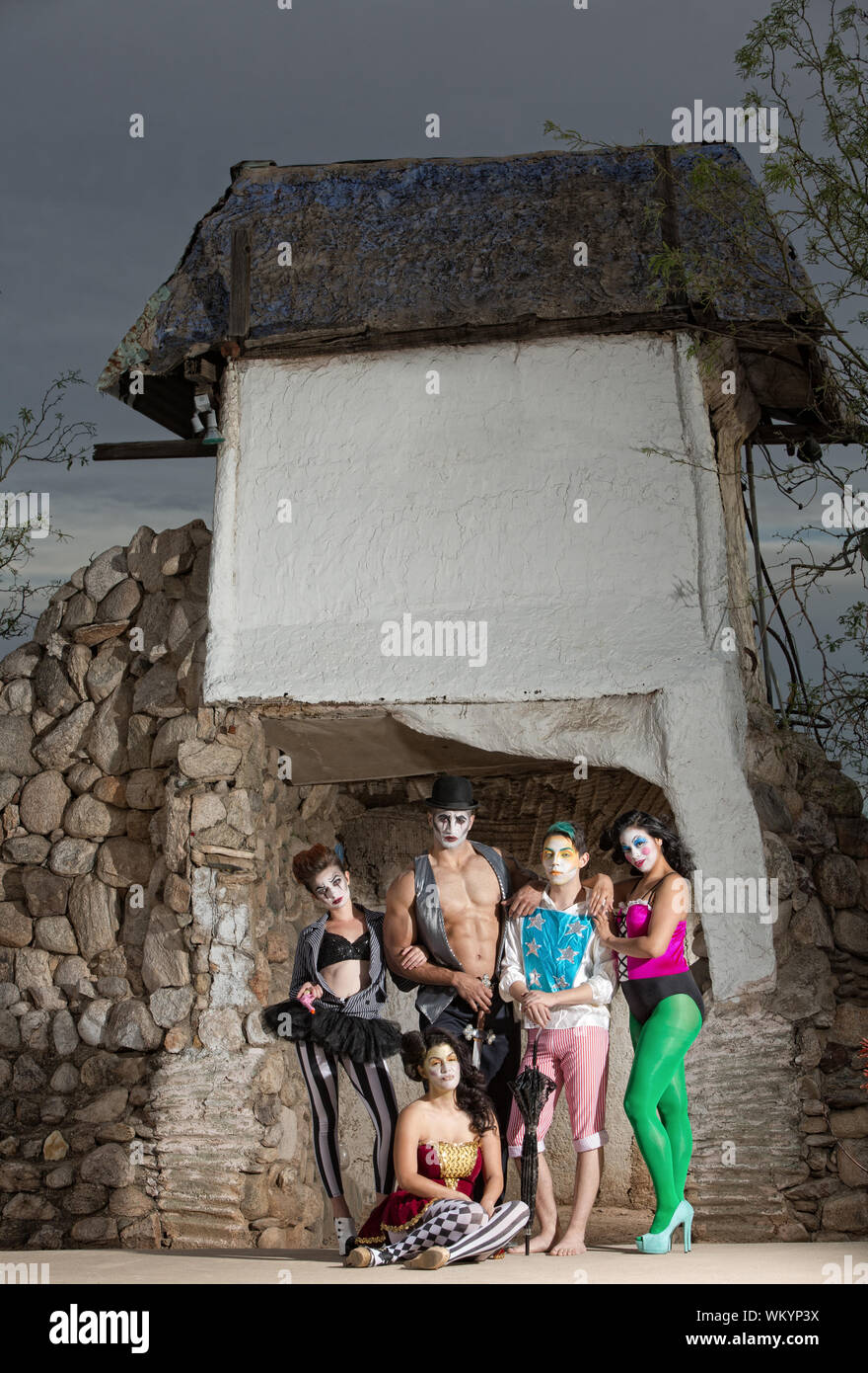 Surreal group of comedy clowns in outdoor stage Stock Photo - Alamy