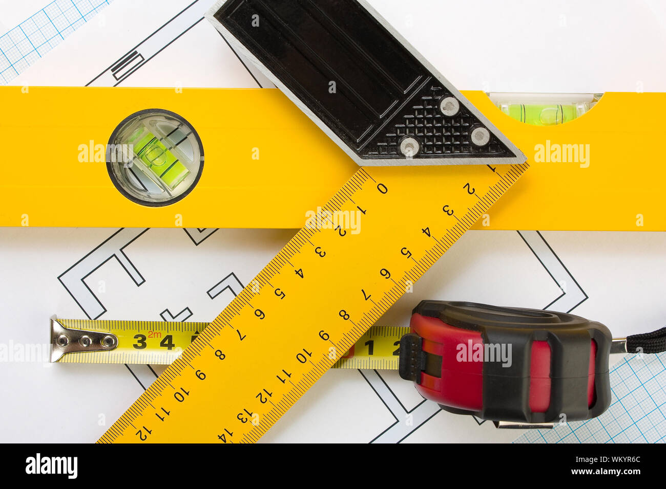 drawing at home with construction tools on a background of graph paper ...