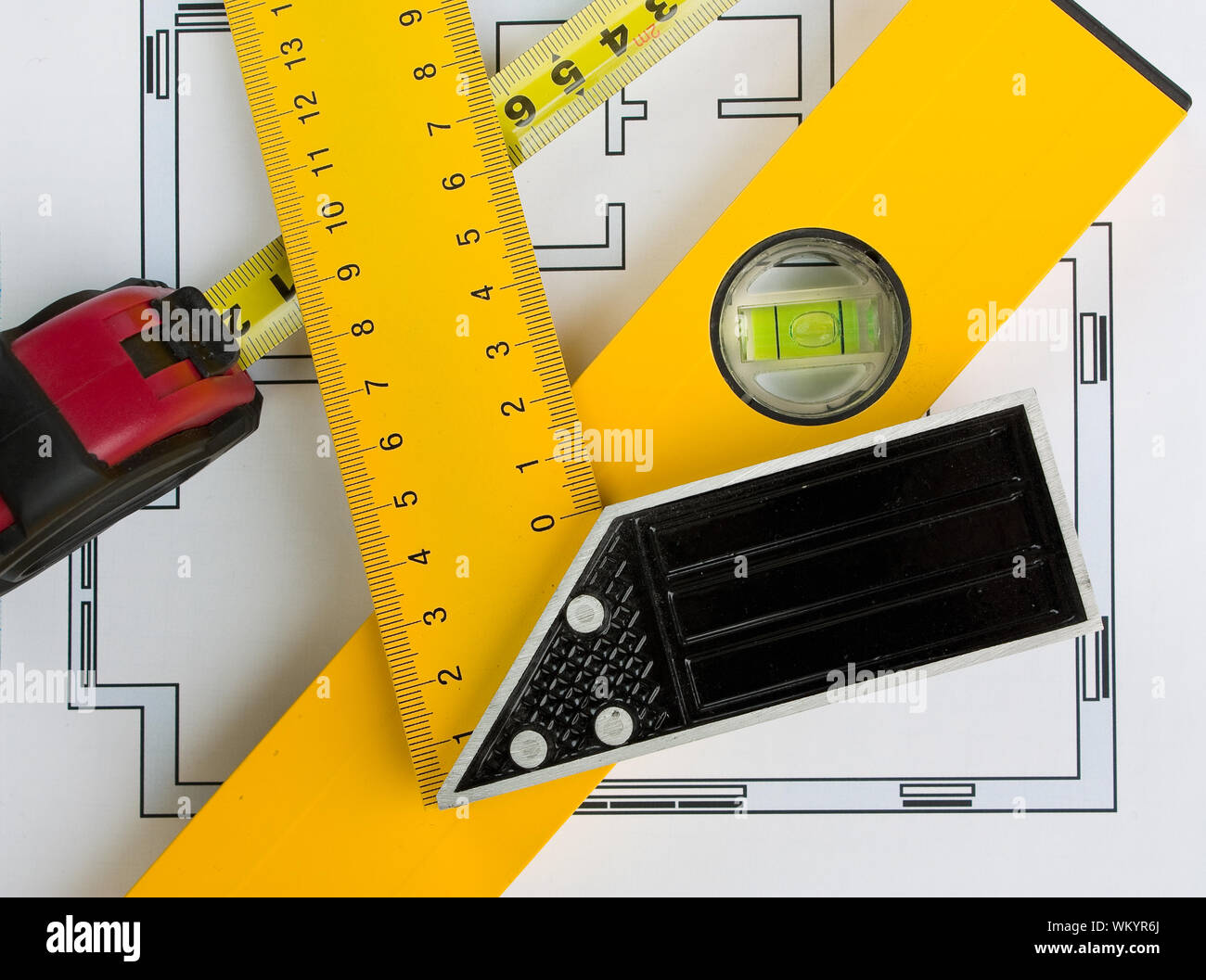 drawing at home with construction tools on a background of graph paper ...