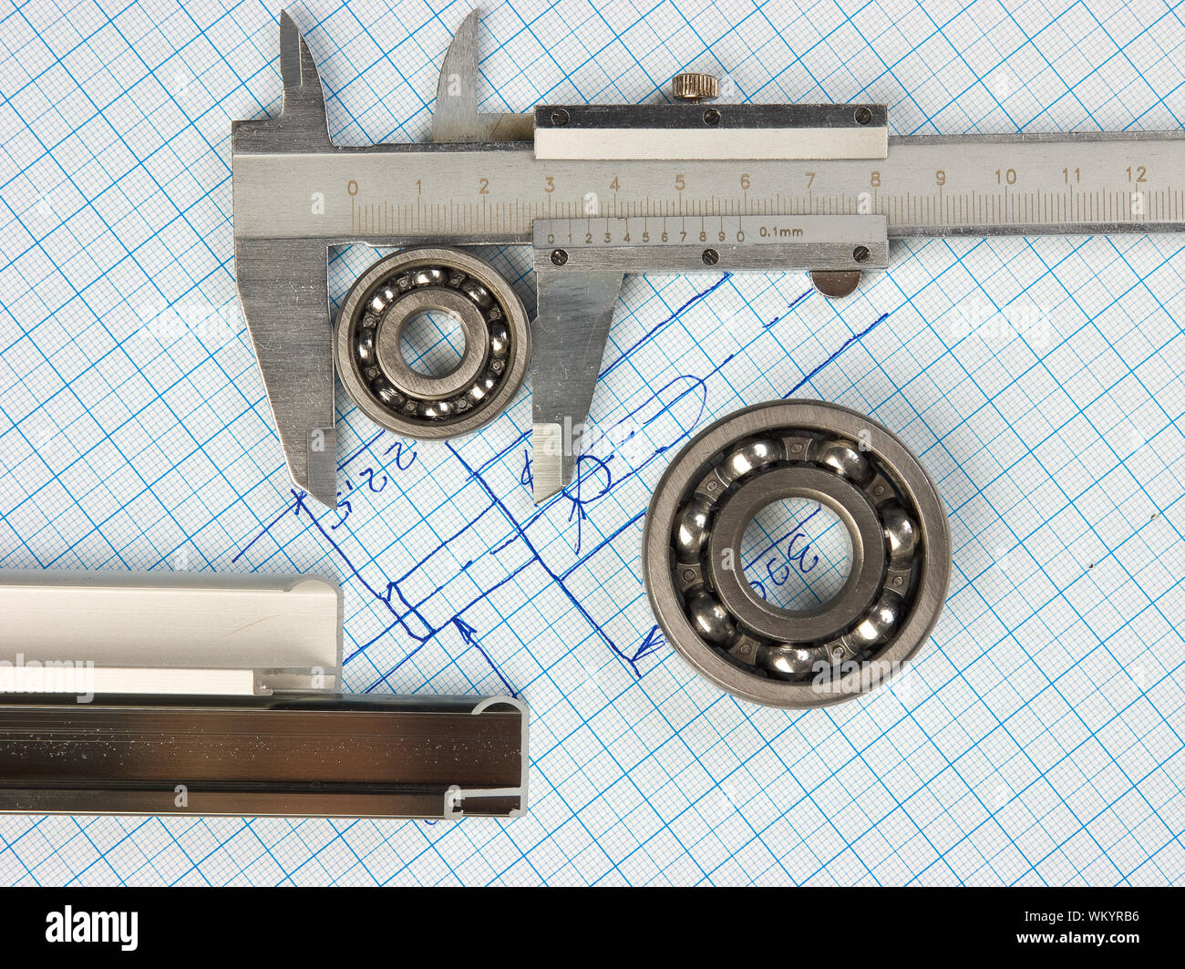 calipers, bearing and square on the background of graph paper Stock ...