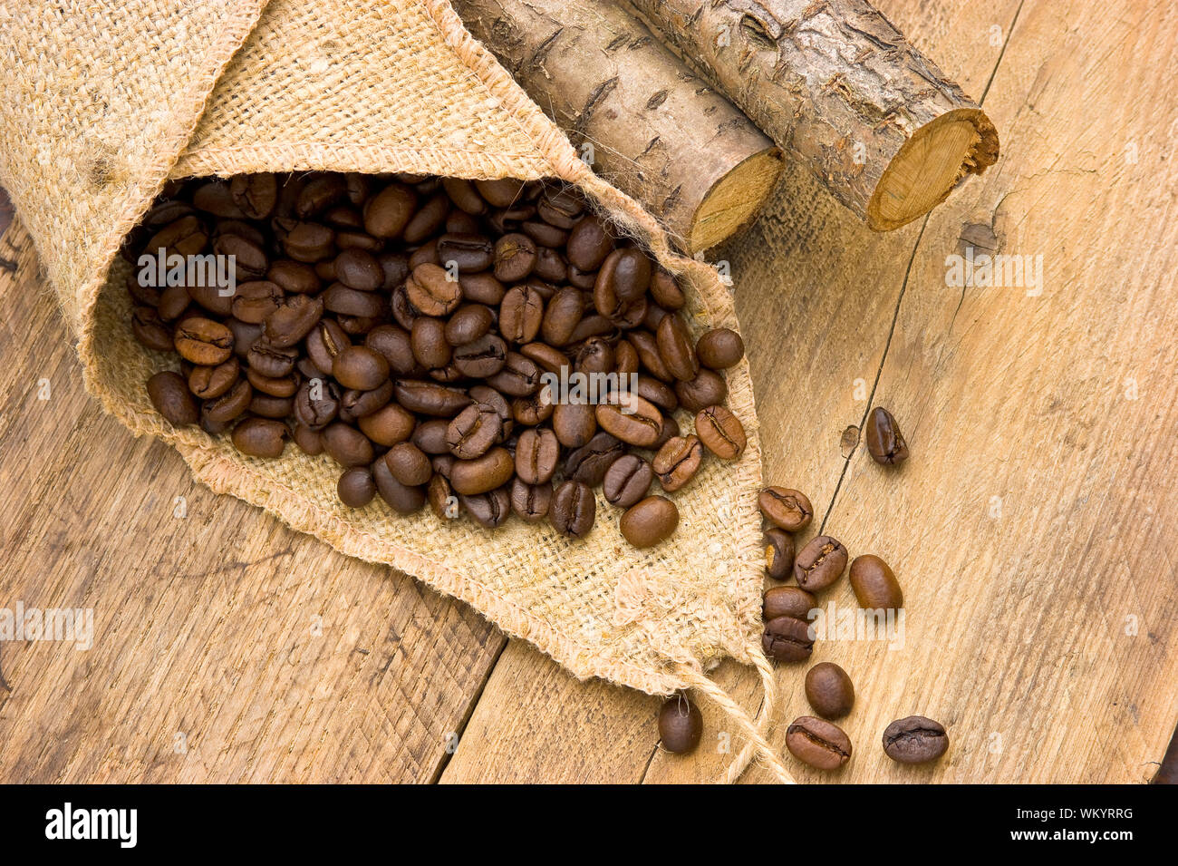 Coffee beans spilled out of the bag Stock Photo - Alamy