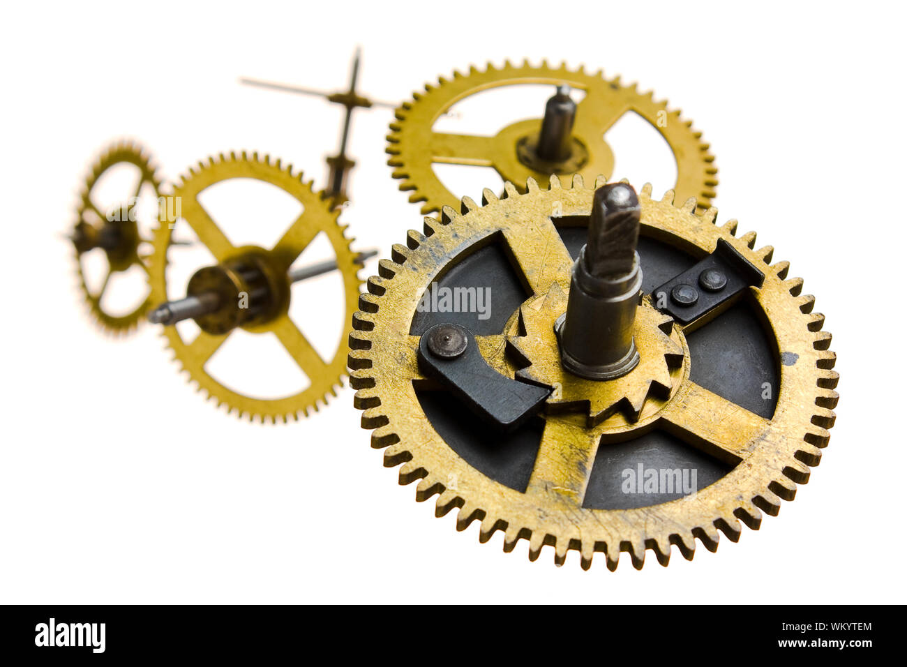 Gear of the clock isolated on white background Stock Photo - Alamy