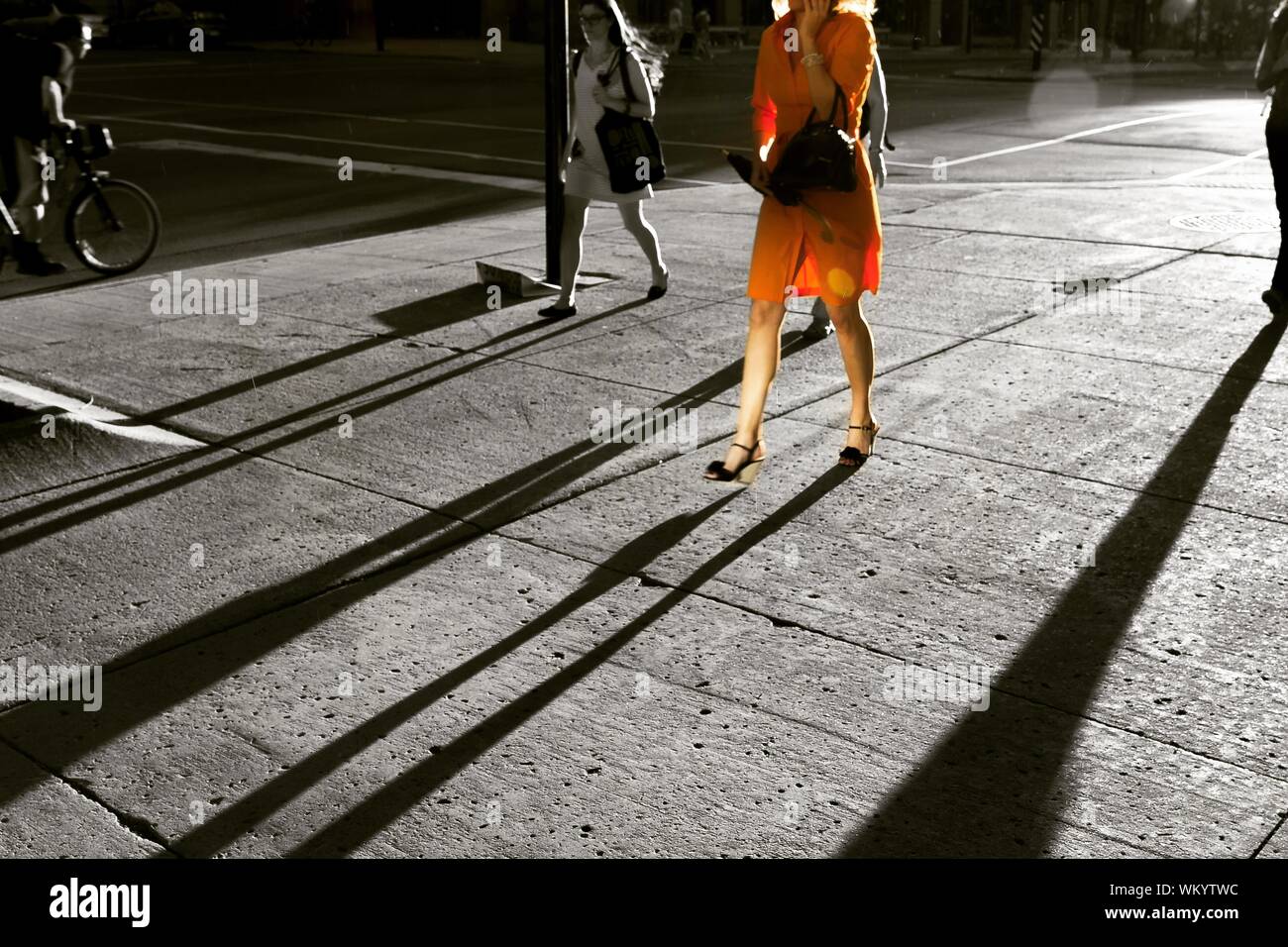 Two women crossing street in hi-res stock photography and images - Alamy