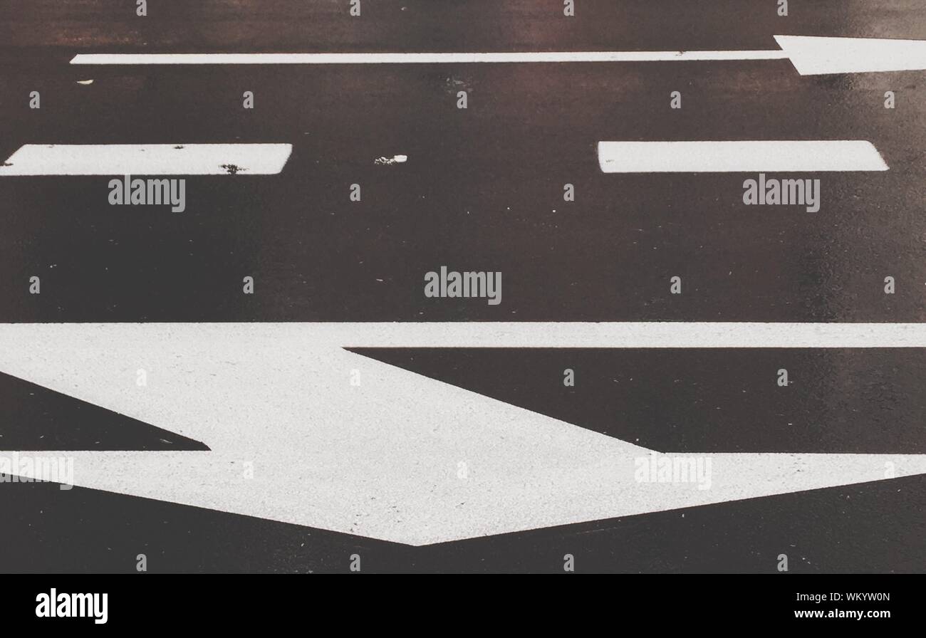 Directional road markings hi-res stock photography and images - Alamy