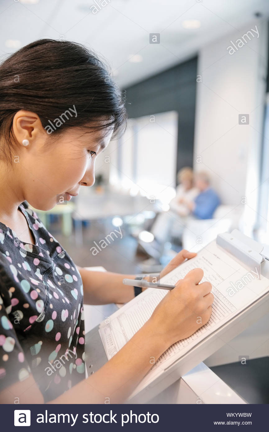 Nurse charting hi-res stock photography and images - Alamy