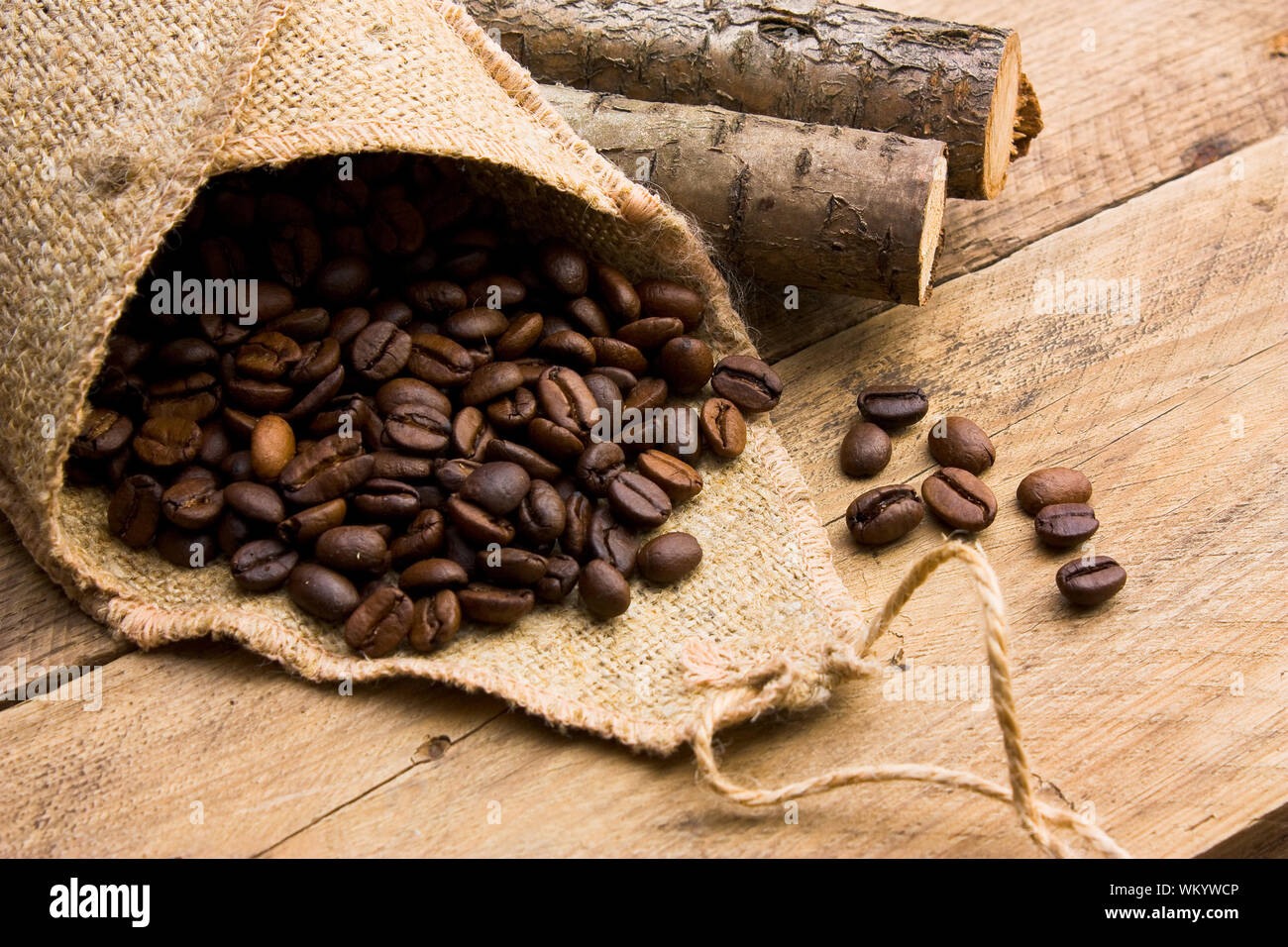 Coffee beans spilled out of the bag Stock Photo - Alamy