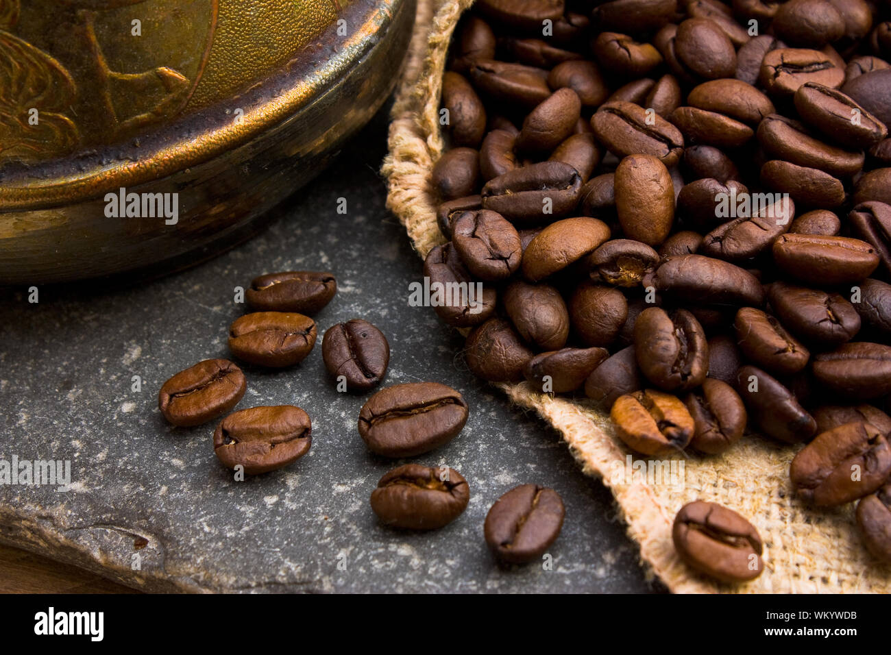 Coffee beans spilled out of the bag Stock Photo - Alamy