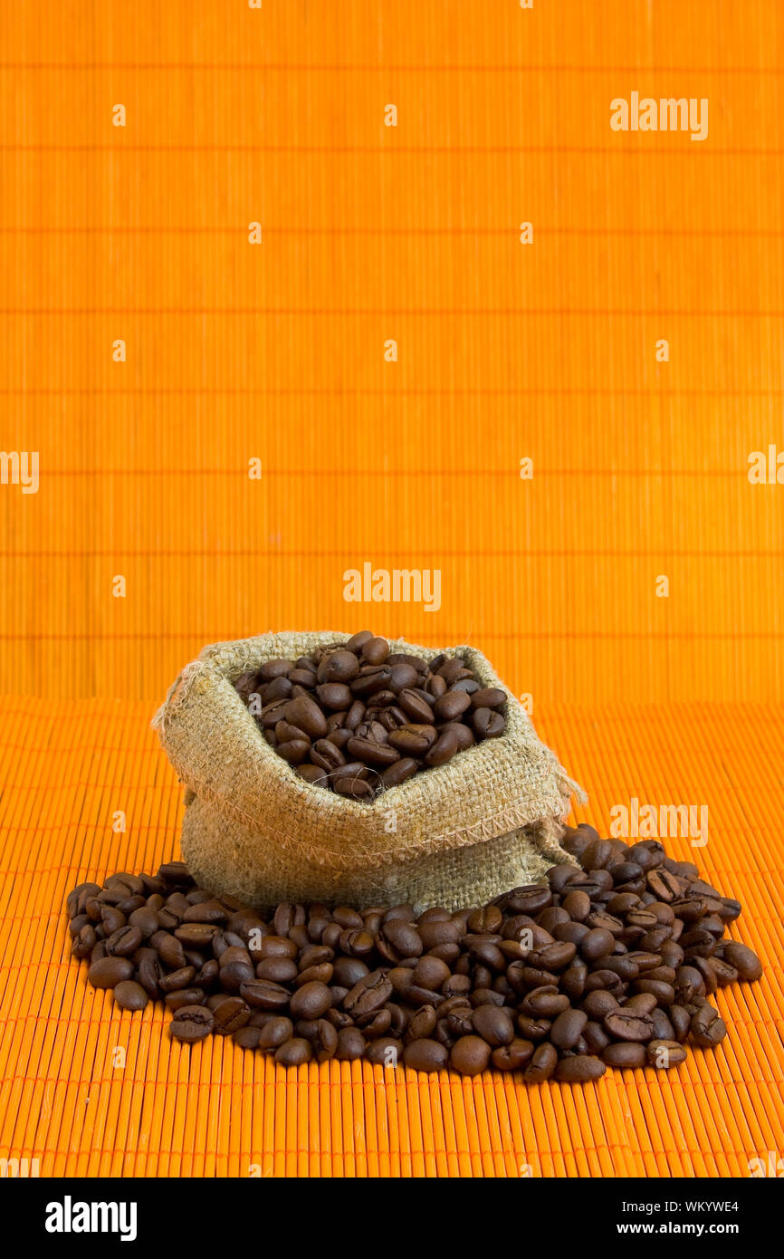 Coffee beans spilled out of the bag Stock Photo - Alamy