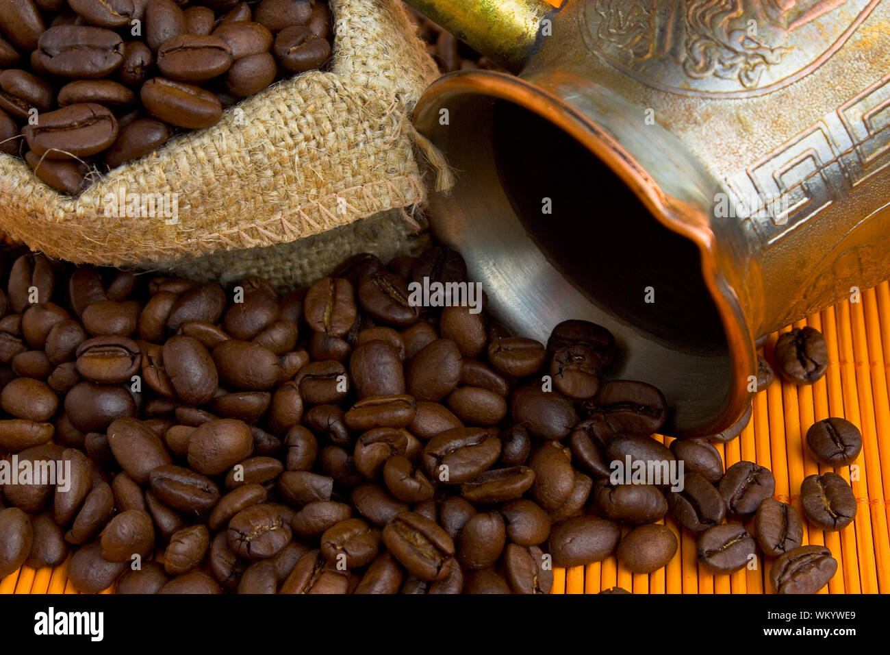 Coffee beans spilled out of the bag Stock Photo - Alamy