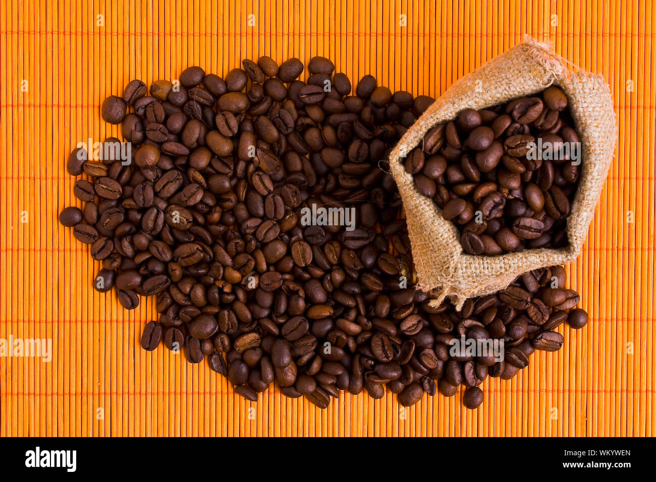 Coffee beans spilled out of the bag Stock Photo - Alamy