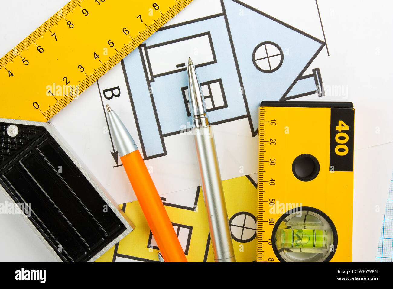 drawing at home with construction tools on a background of graph paper ...