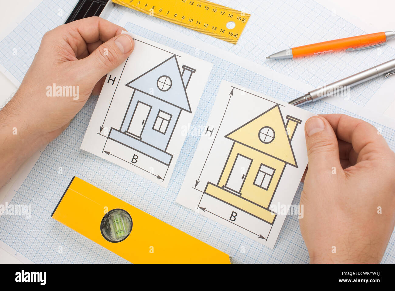 drawing at home with construction tools on a background of graph paper ...
