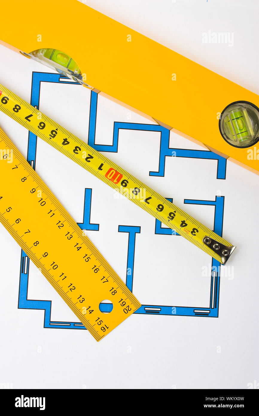 drawing at home with construction tools on a background of graph paper ...