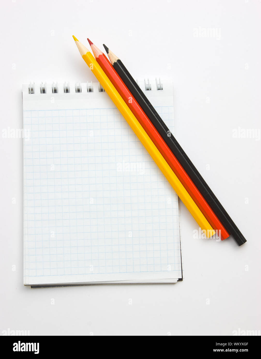 Pencils and notepad isolated on white background Stock Photo - Alamy