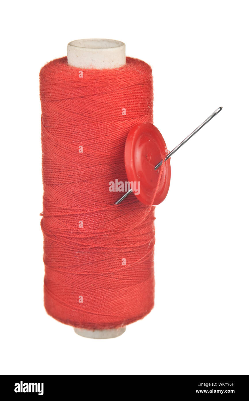 Button pinned the needle to the reel of thread Stock Photo - Alamy