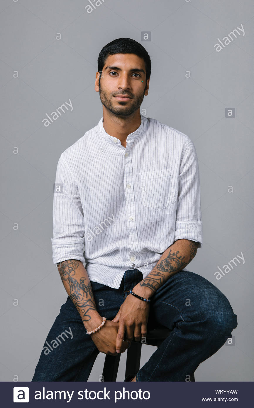 Portrait three pakistani men sitting hi-res stock photography and ...