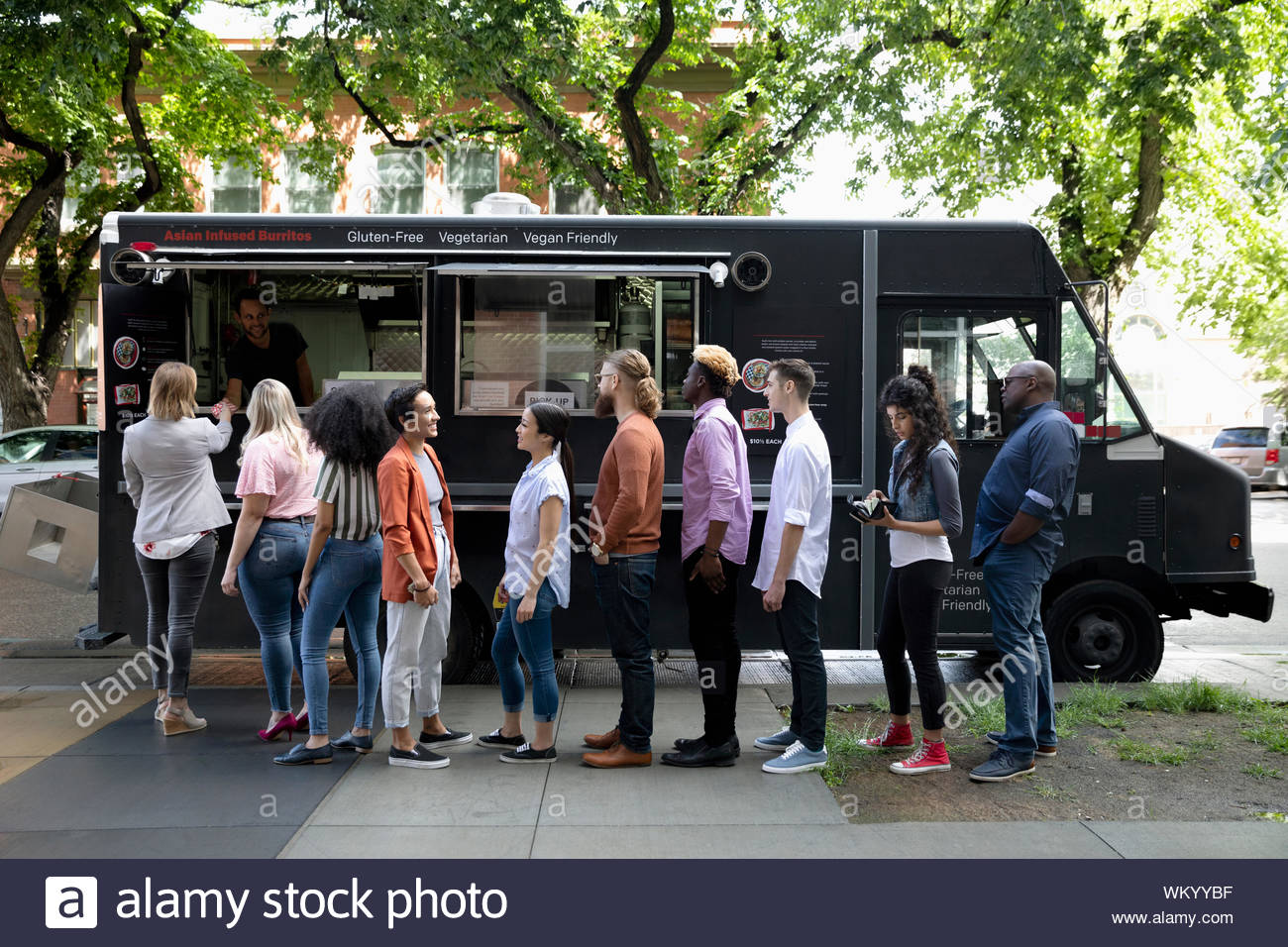 Standing holding in a row food and drink working hi-res stock ...
