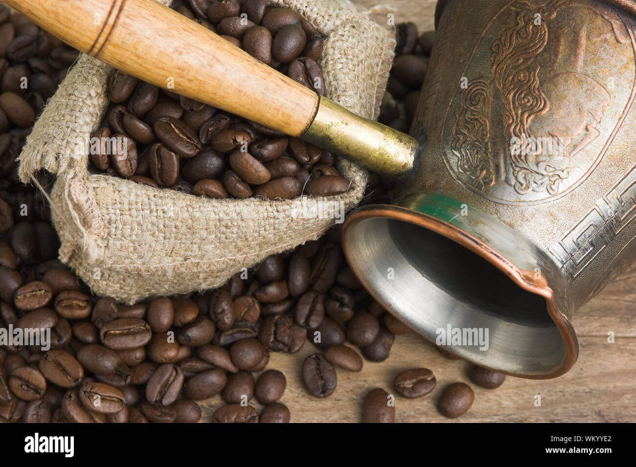 Coffee beans spilled out of the bag Stock Photo - Alamy