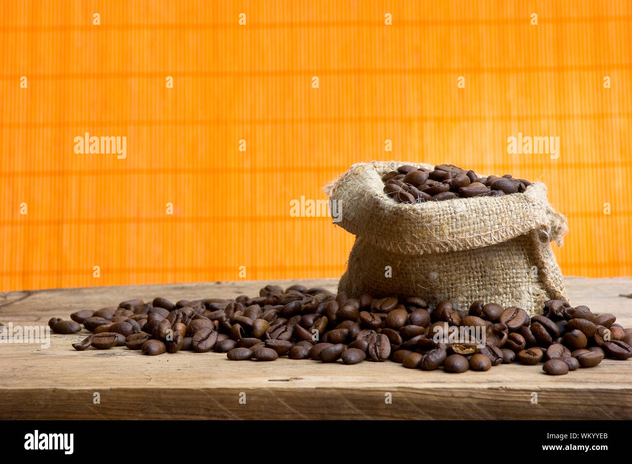 Coffee beans spilled out of the bag Stock Photo - Alamy