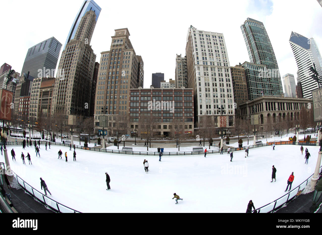 People enjoying the ice skating rink in Millennium Park in downtown ...