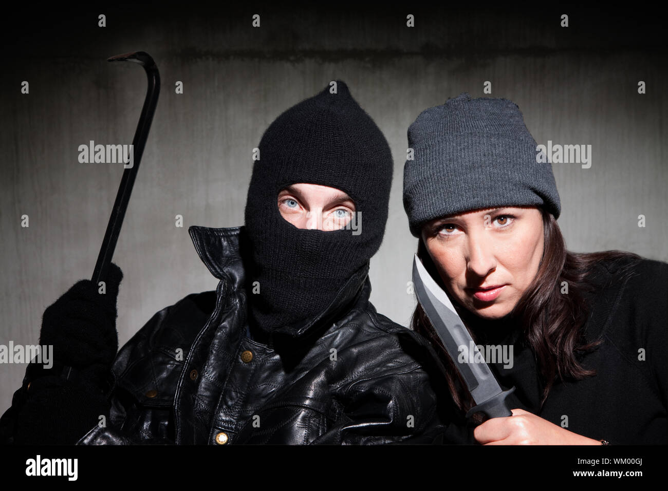 Male and female criminals wielding dangerous weapons Stock Photo - Alamy