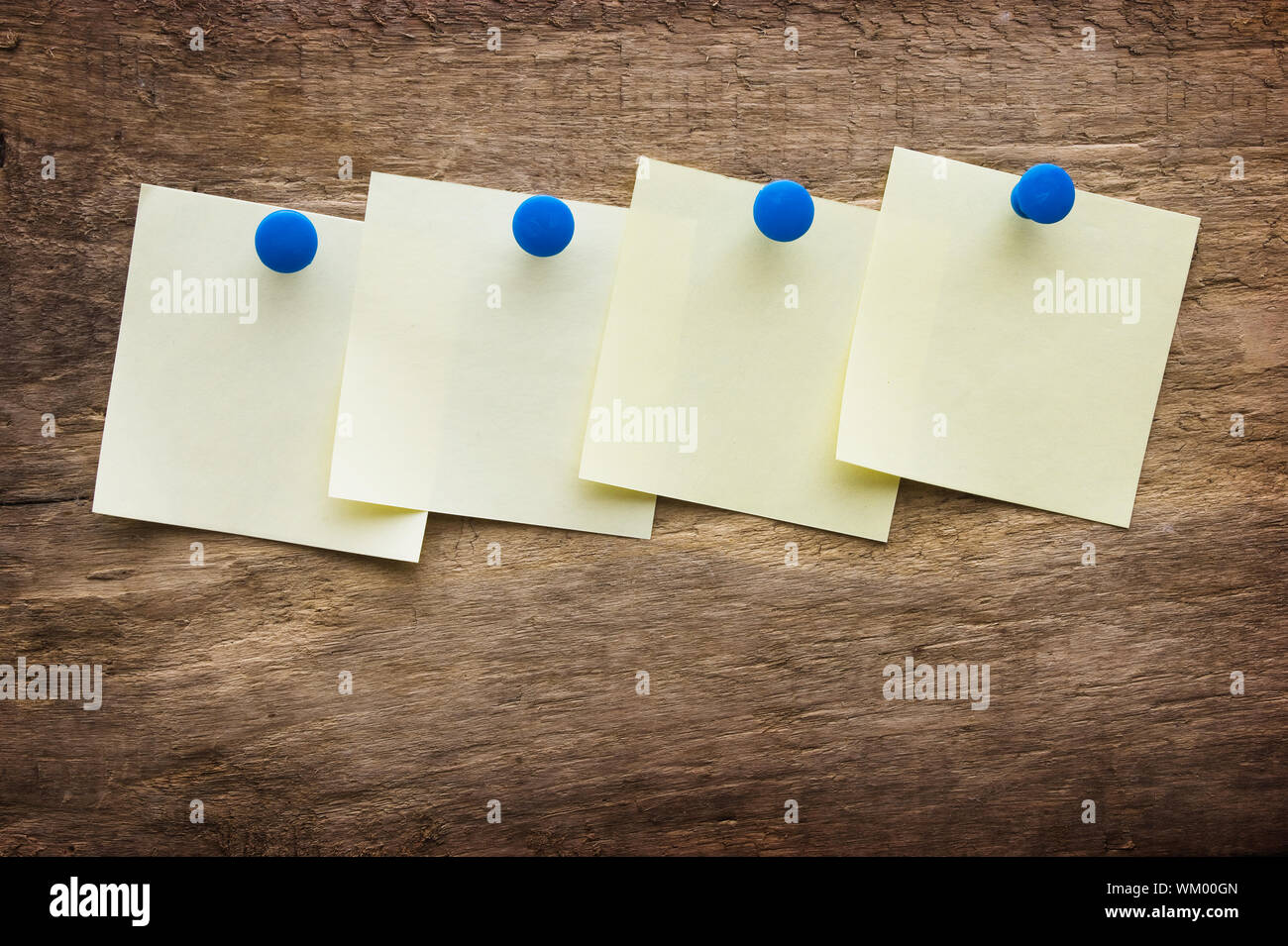 A piece of paper pinned the button on the board Stock Photo - Alamy