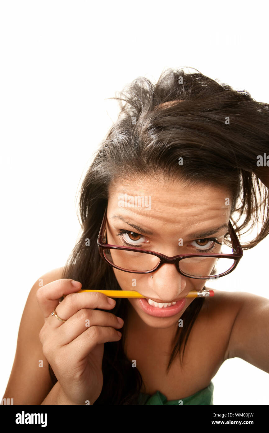 Nervous Hispanic Woman Chewing on a Pencil Stock Photo - Alamy