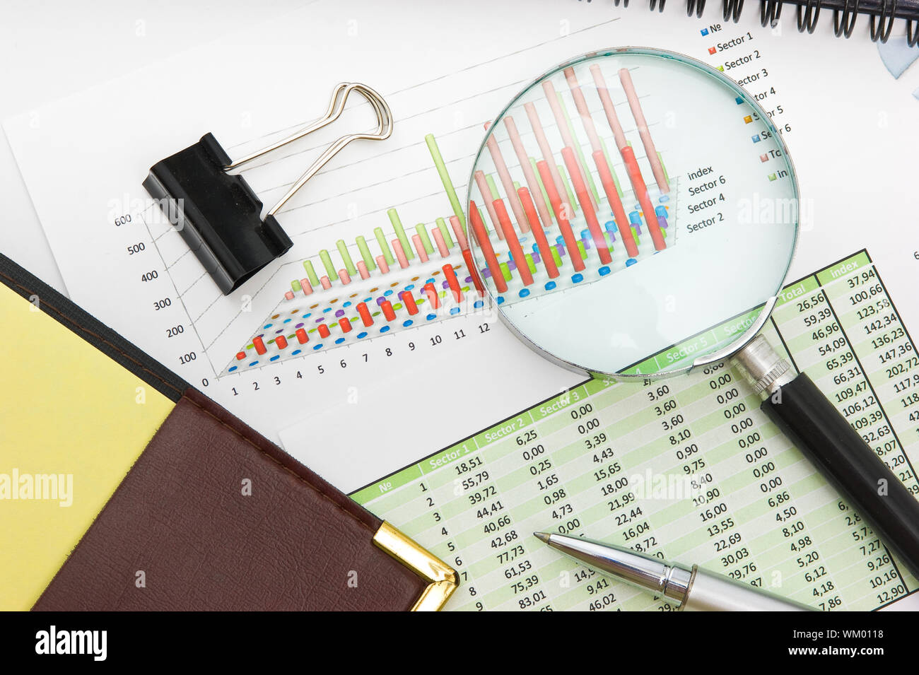 Graphs tables and documents laid on the table Stock Photo - Alamy