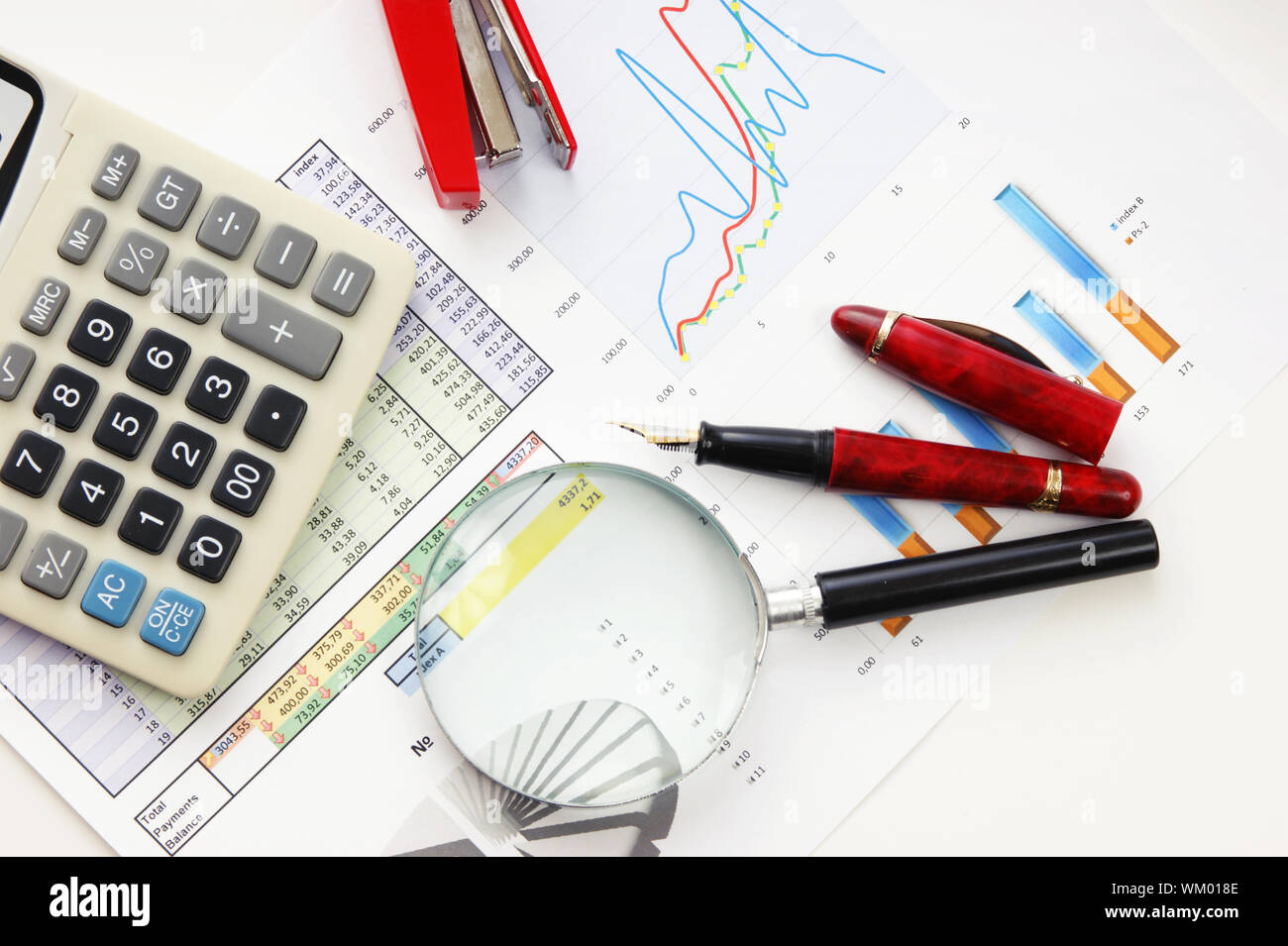 Graphs tables and documents laid on the table Stock Photo - Alamy