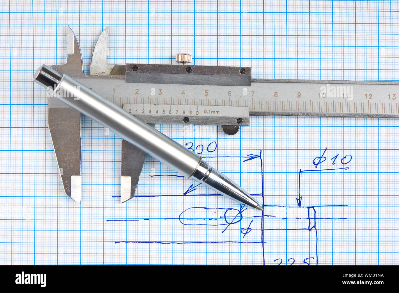 calipers, bearing and square on the background of graph paper Stock ...