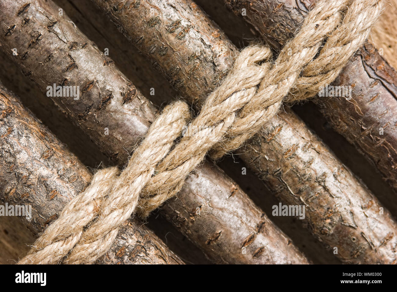 Strips of wood bound with old rope Stock Photo - Alamy