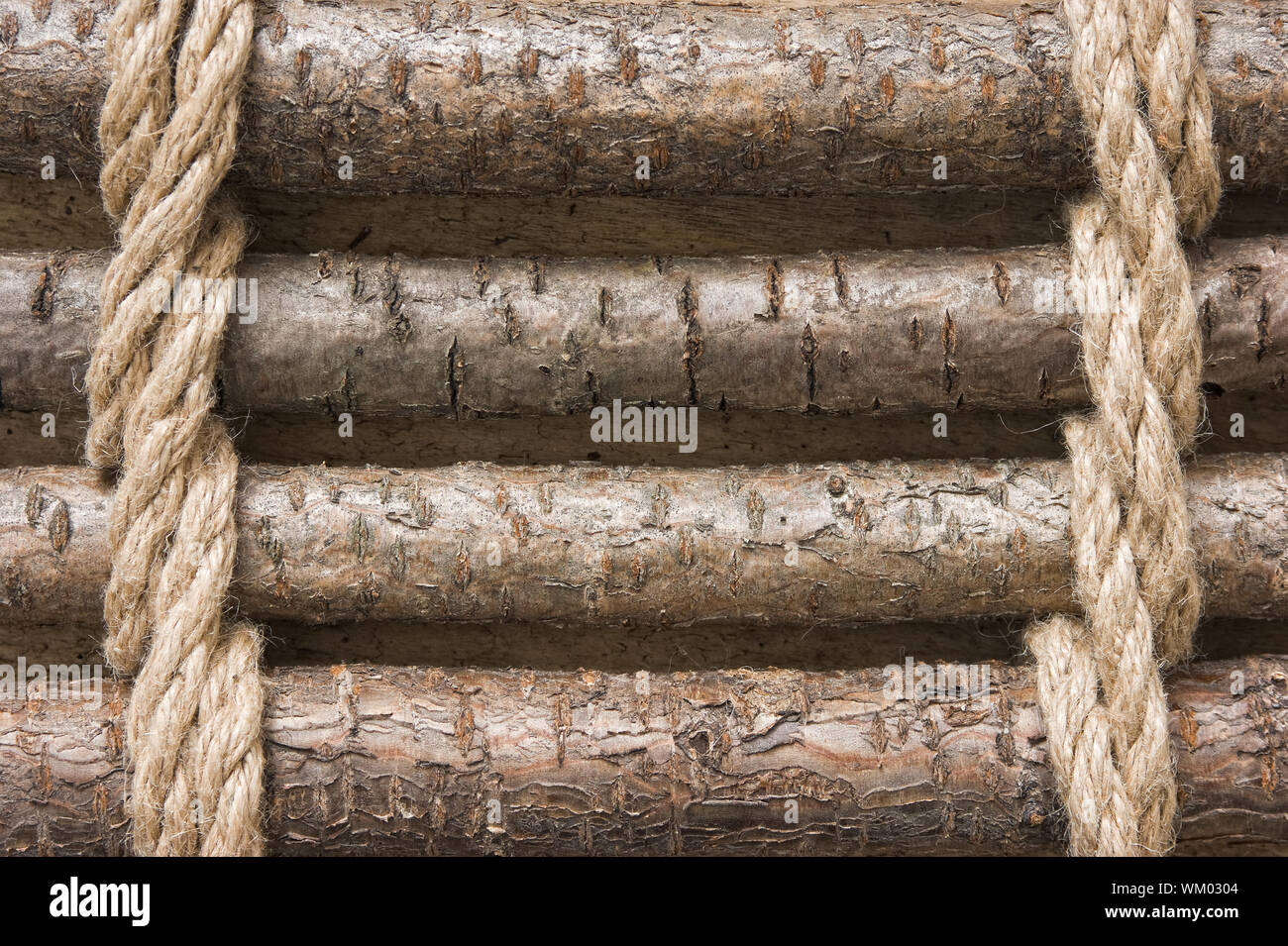 Strips of wood bound with old rope Stock Photo - Alamy