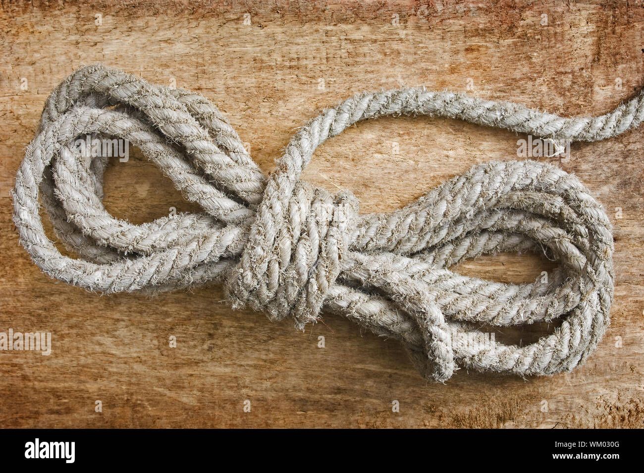 Rope with knots on the background of the old wooden boards Stock Photo ...