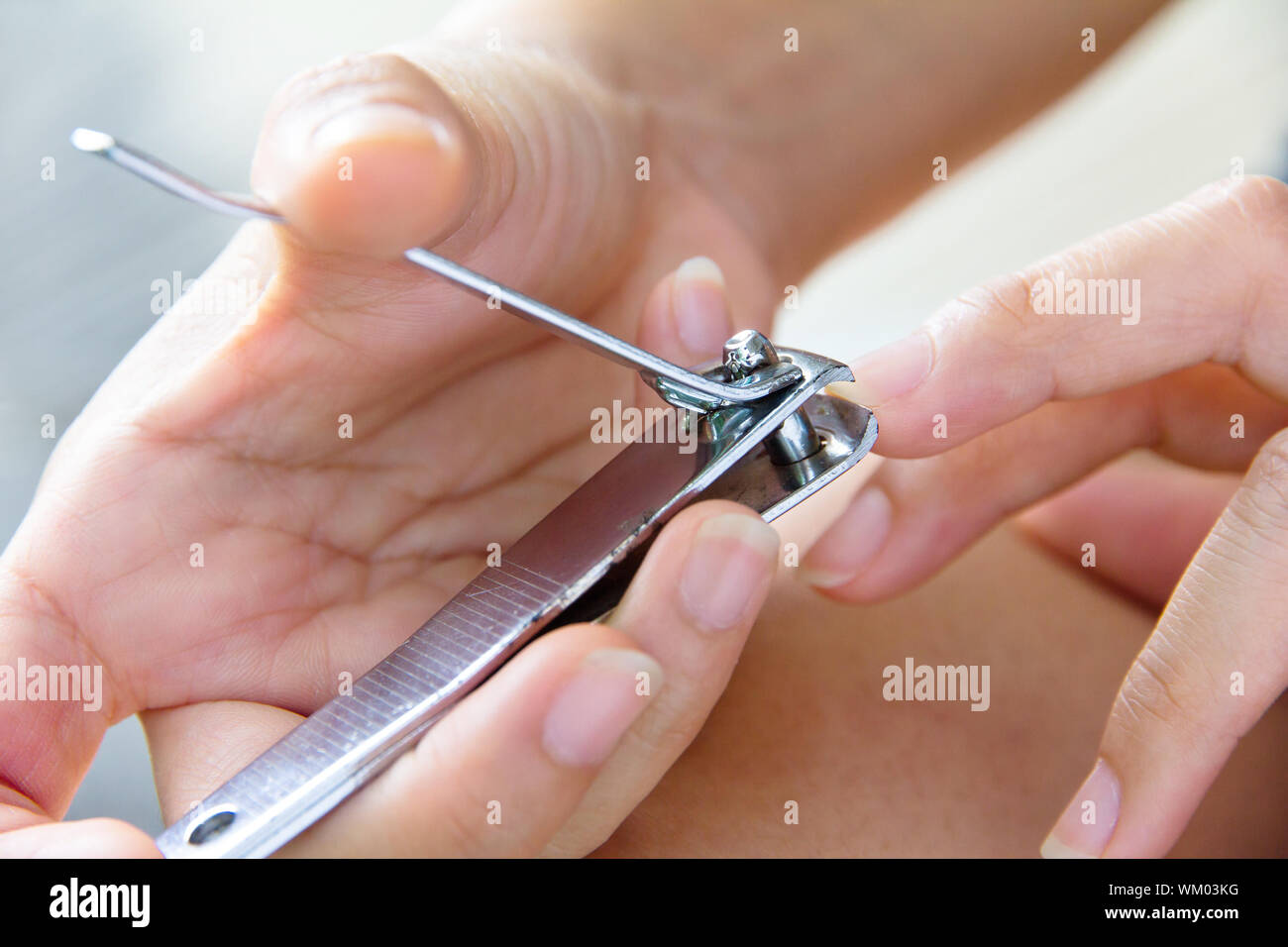 Trimming fingernails hi-res stock photography and images - Alamy