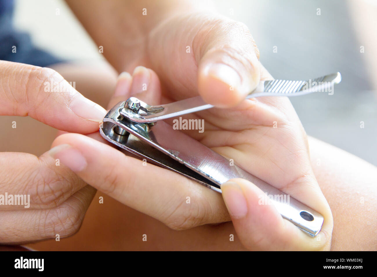 Cutting your fingernails Stock Photo - Alamy