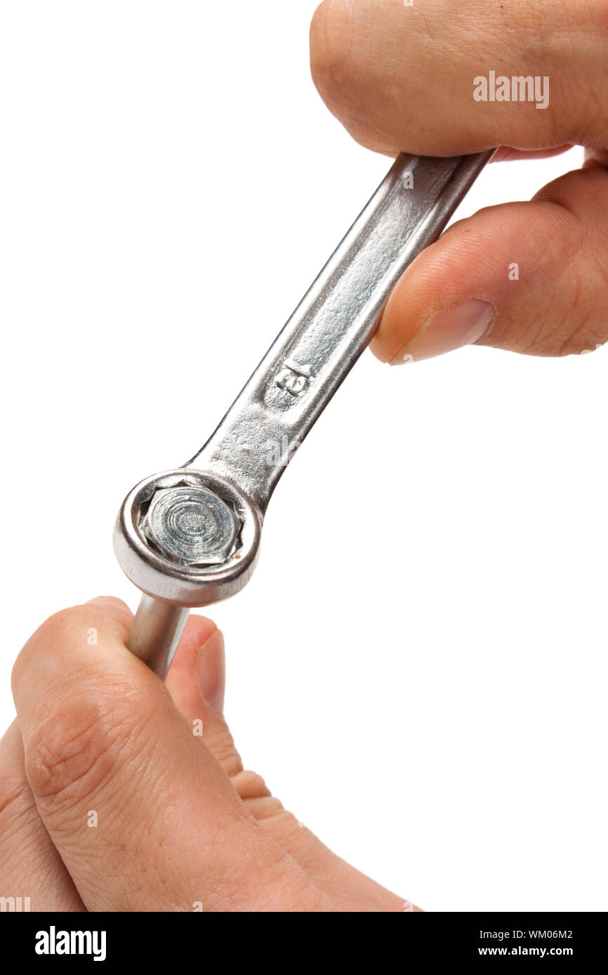 screw with a wrench in hands isolated on white background Stock Photo ...