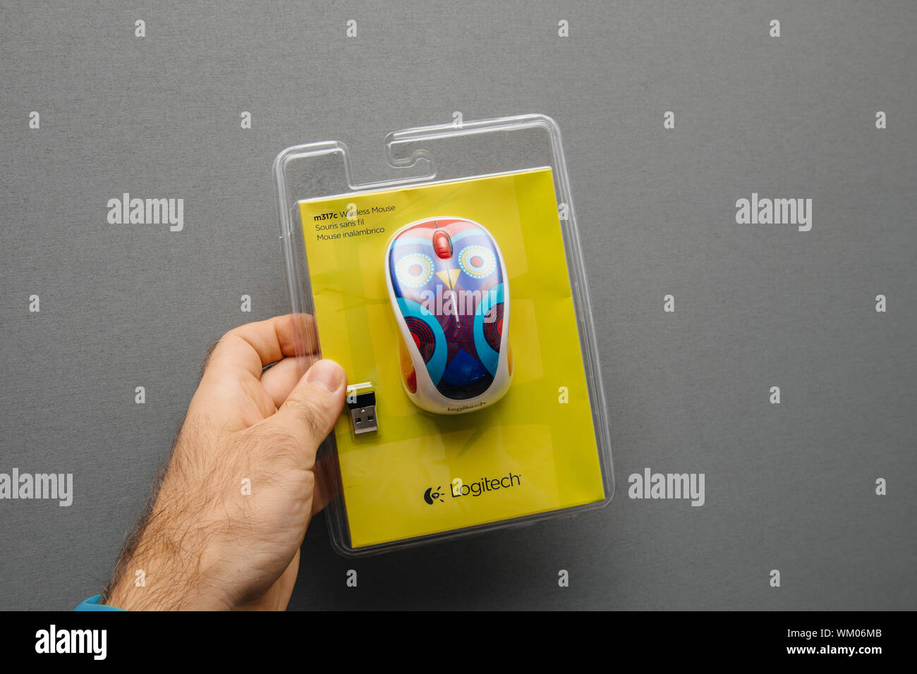 Paris, France - Oct 21, 2017: Man hand holding Logitech m317c wireless ...