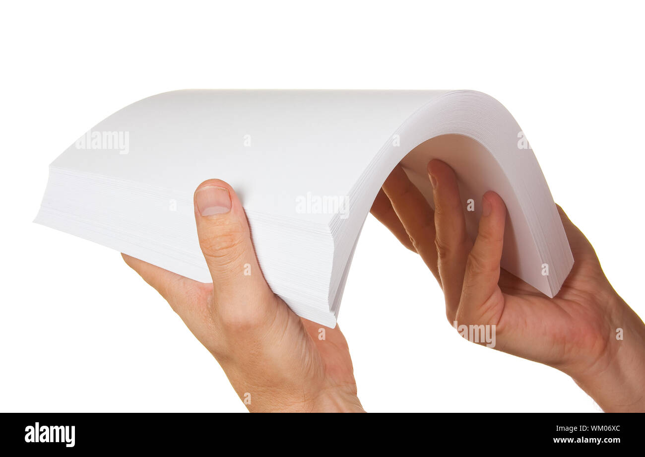 a stack of paper in hand isolated on white background Stock Photo - Alamy
