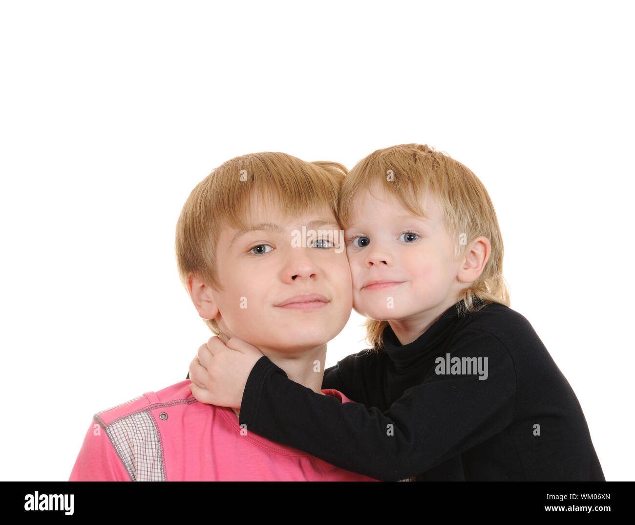 Two brothers embrace isolated on white background Stock Photo - Alamy