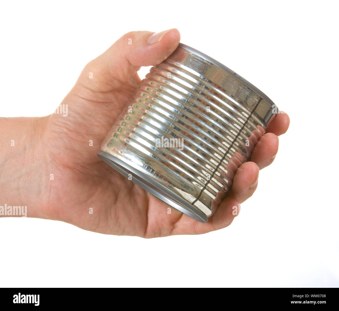 Food can in hand isolated on white background Stock Photo - Alamy