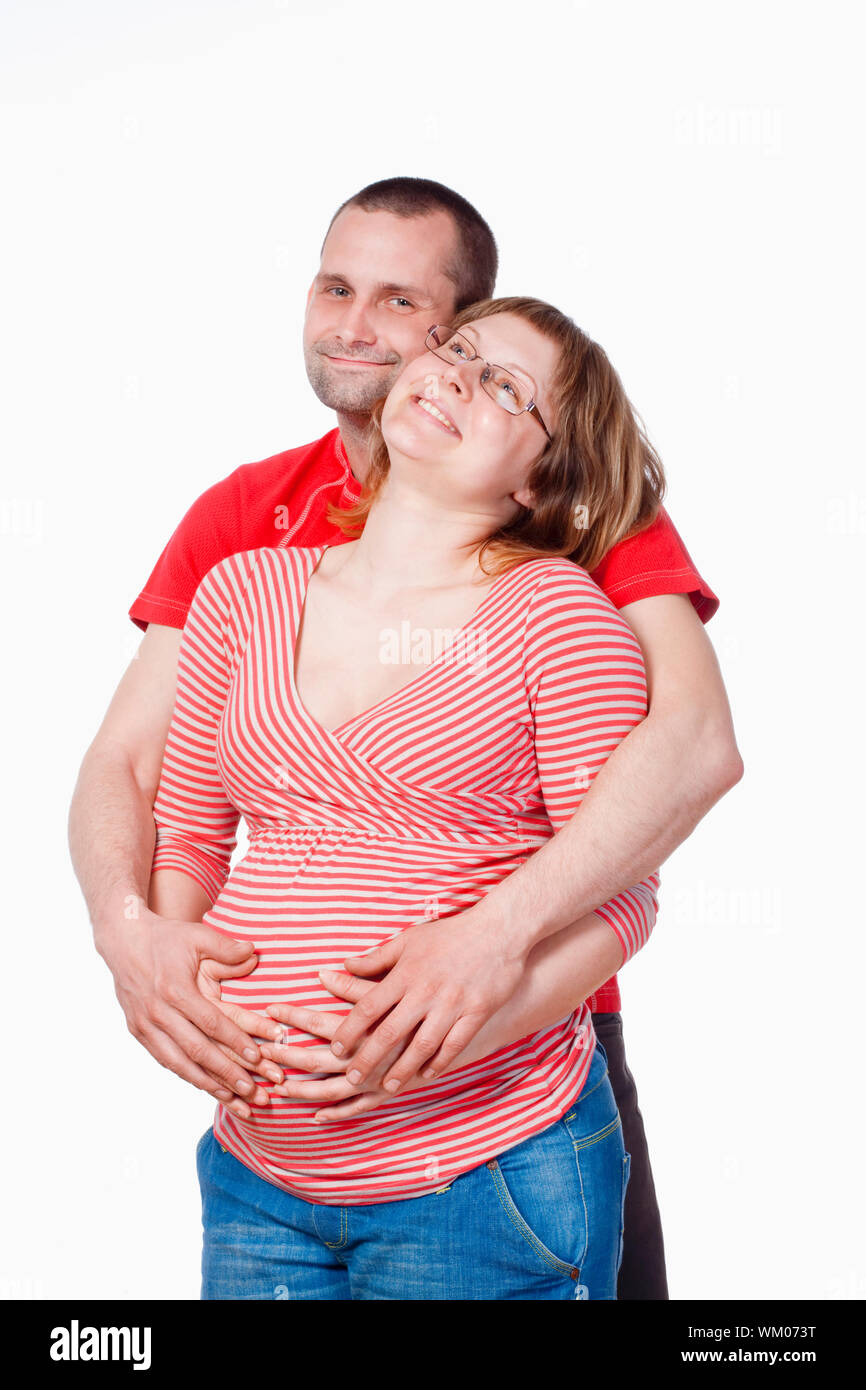 happy expecting couple holding each other - isolated on white Stock ...