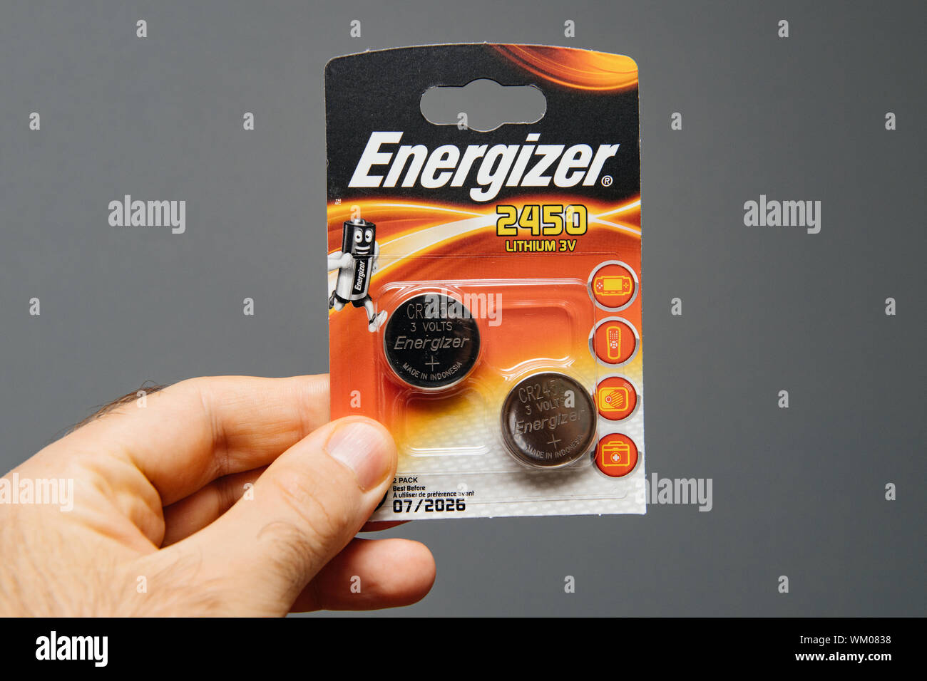Paris, France - Aug 20, 2019: Man hand holding Energizer 2450 Lithium ...
