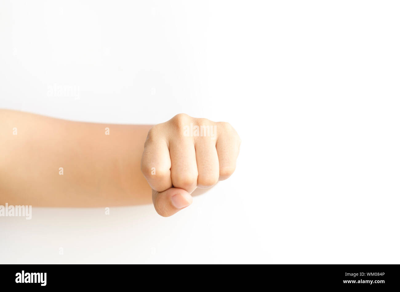 asia woman strength hand sign on a white background Stock Photo - Alamy
